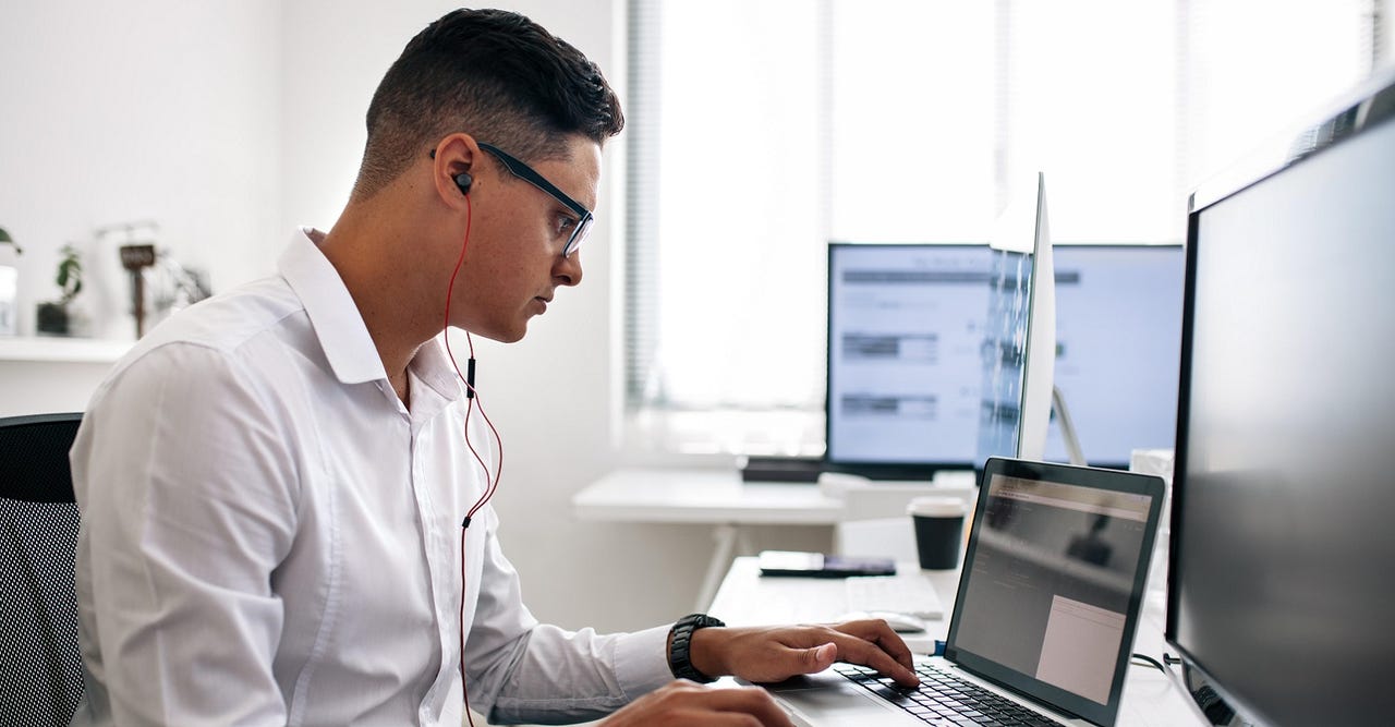 software developer working on his computer software developer working on his computer
