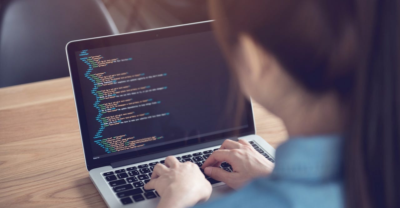 woman coding on computer woman coding on computer