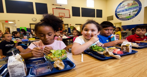 Trump rolls back Michelle Obama's healthy school lunch program