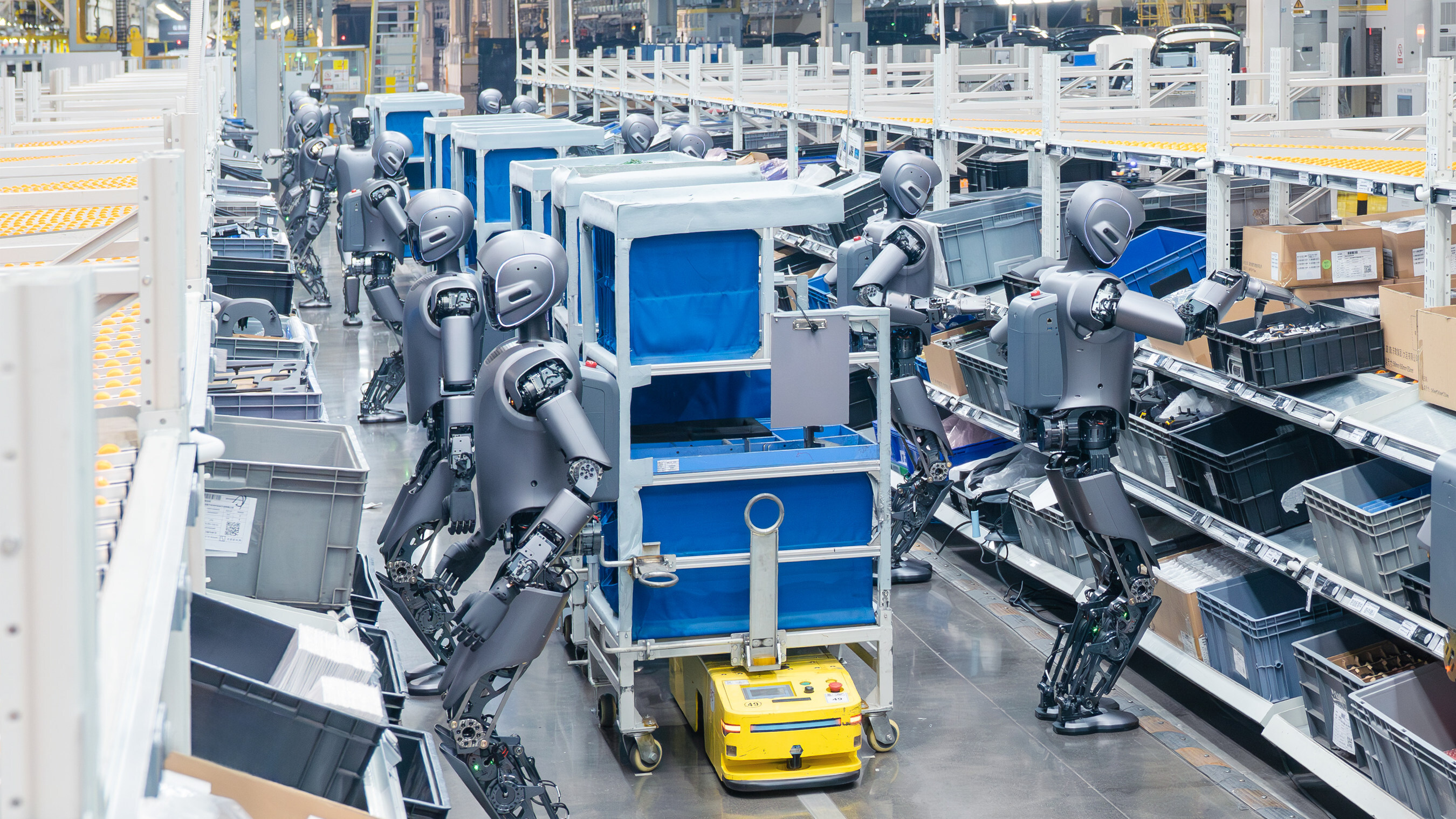 Humanoid Robots Work Collaboratively at Auto Factory