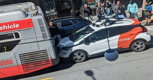 Driverless Taxi Crashes Into Bus