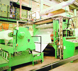 Using an AC motor as a brake for web unwind applications