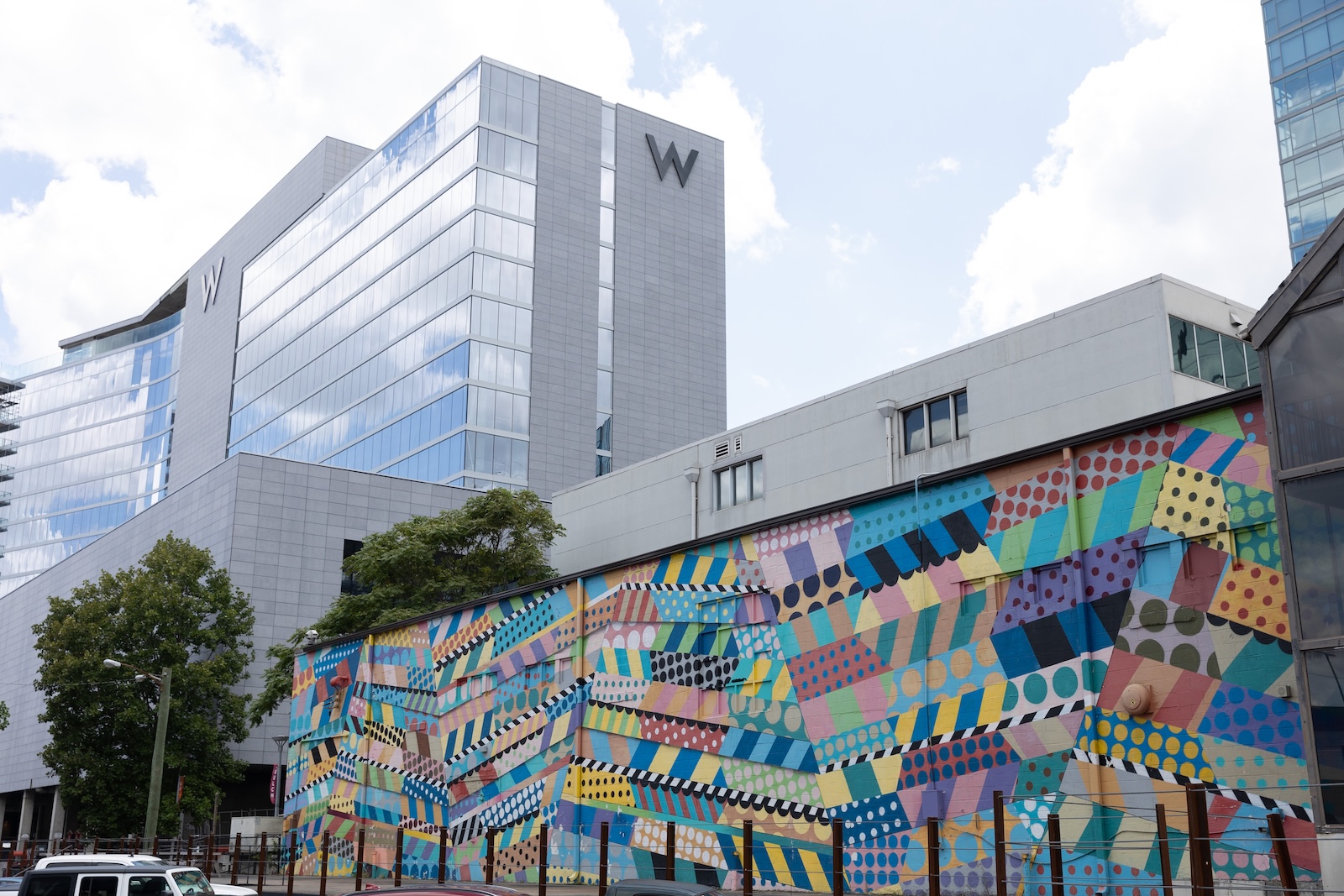 A vibrant mural depicting various colours and patterns on the side of a ...