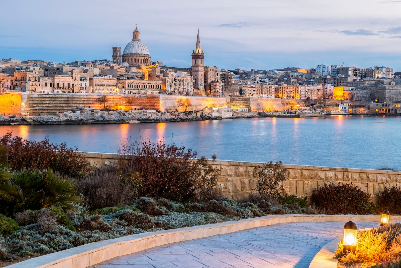 The impressive landscape of Valetta is depicted, the sun is slowly ...