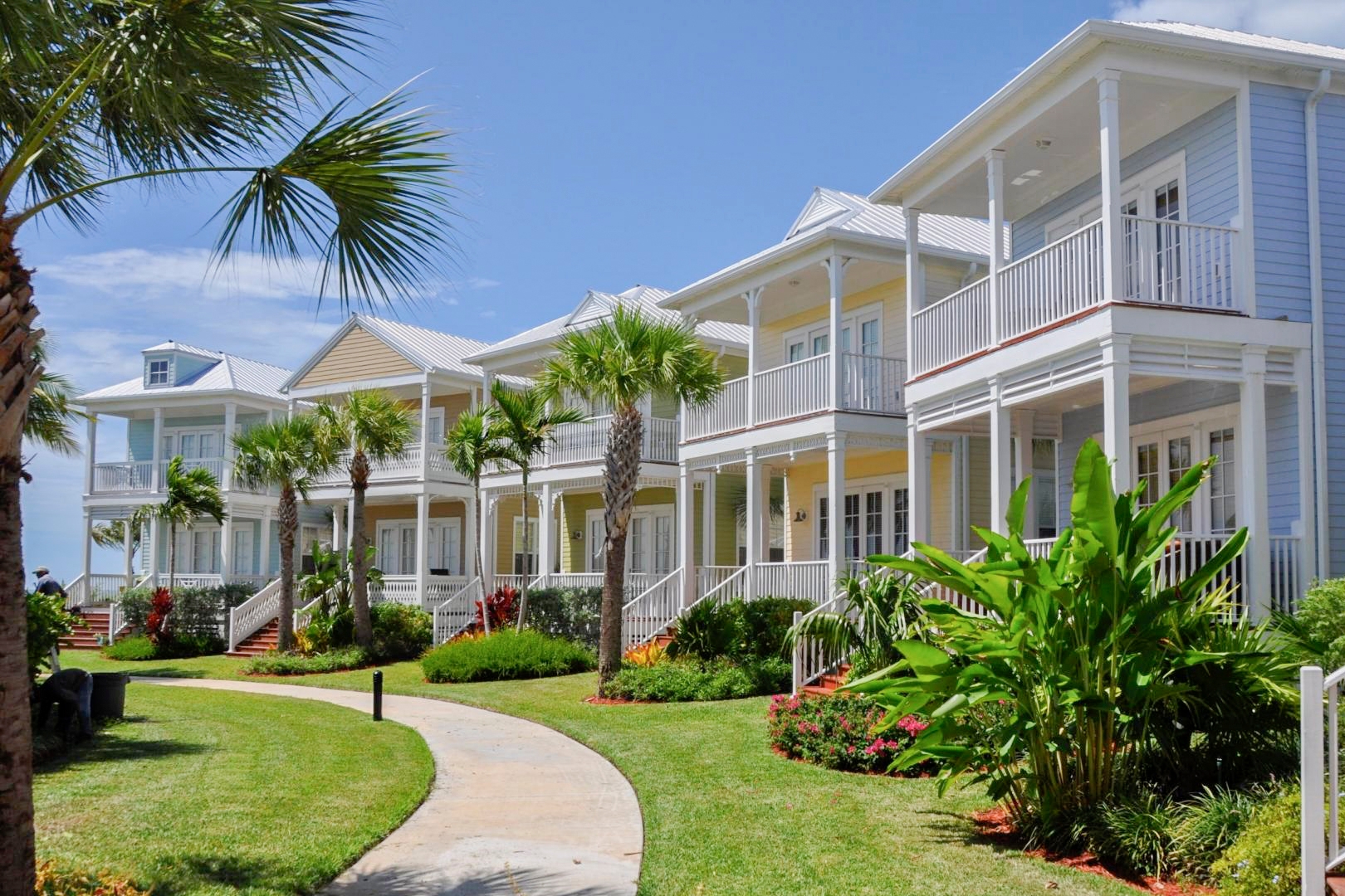 Beachfront homes lined with palm trees at Anglers Reef Getaway ...