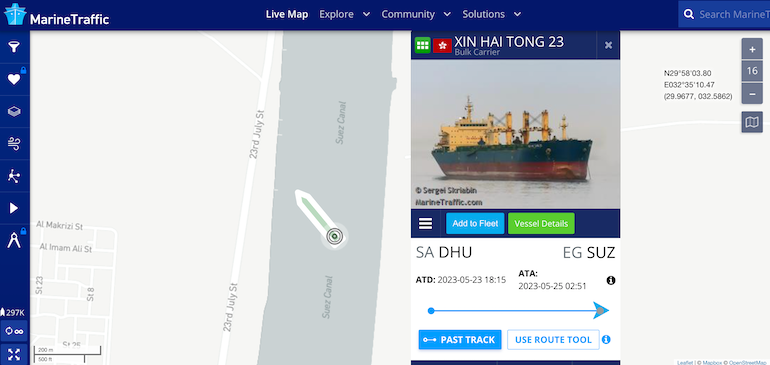 Bulker grounded in Suez Canal, tugs trying to refloat vessel