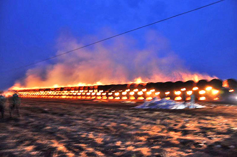Cotton fire rages as round bales burn in gin yard — photos | Farm Progress