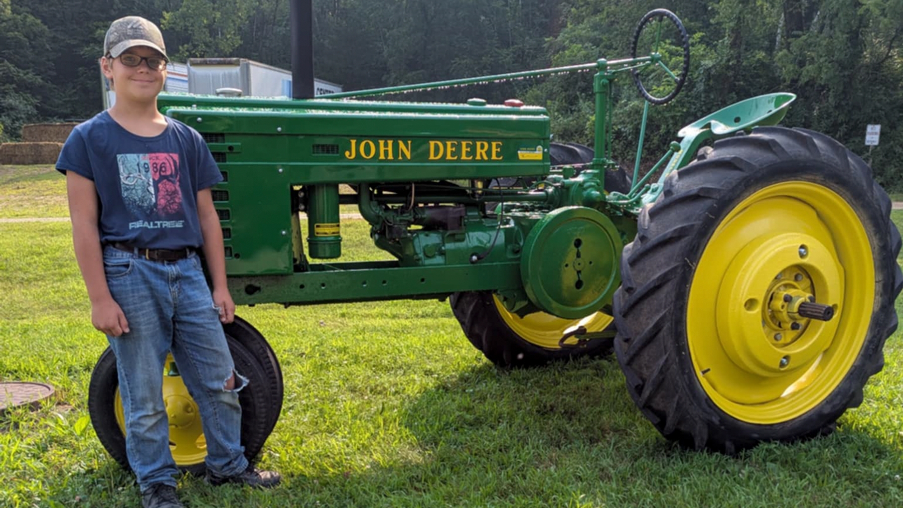 Young farmer restores vintage John Deere tractor