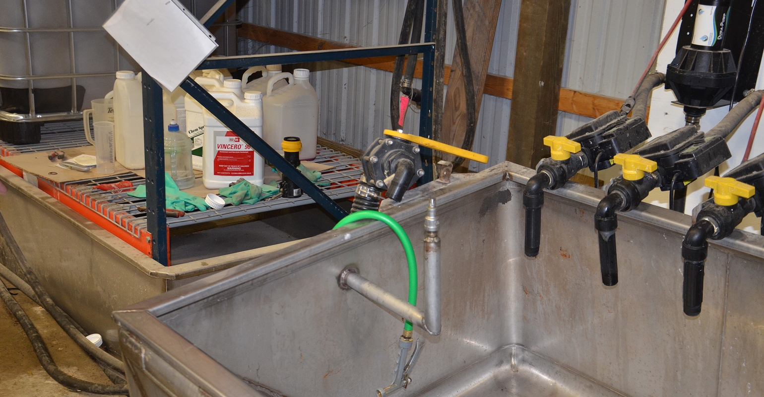 This setup makes triple-rinsing jugs easy