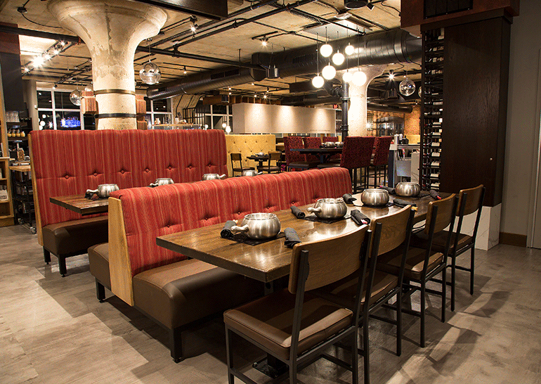 Melting Pot’s new design features ‘hot kitchen,’ expanded bar